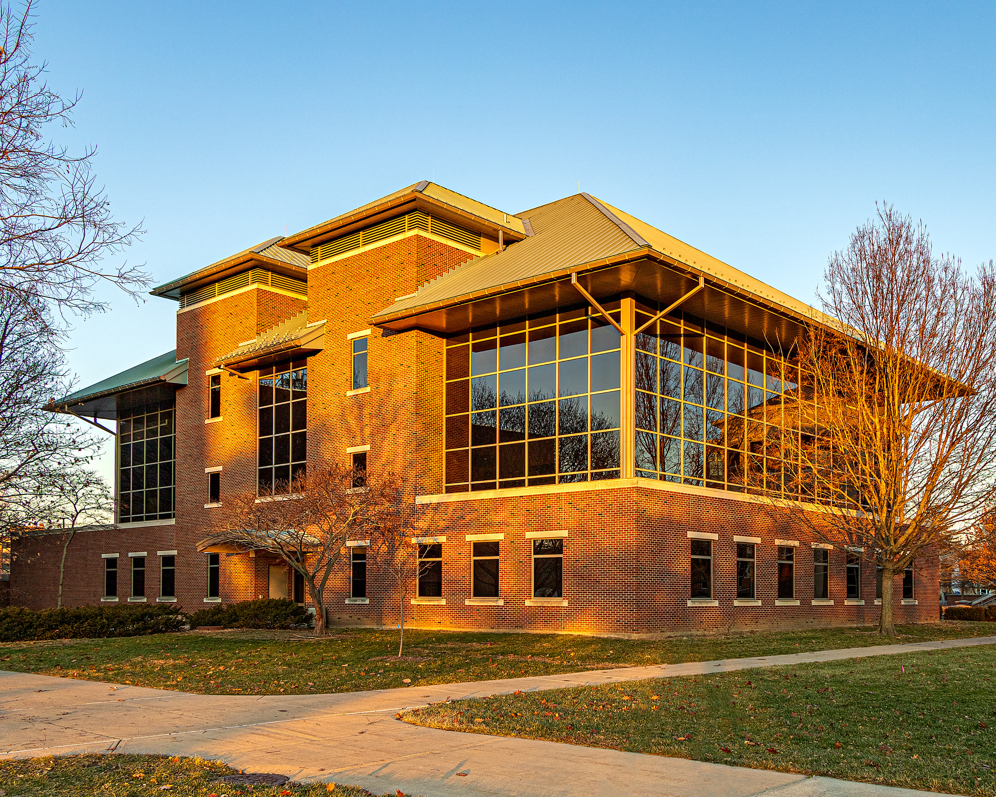 Modern Brick Building Bathed in Golden Sunlight | city photo by ...