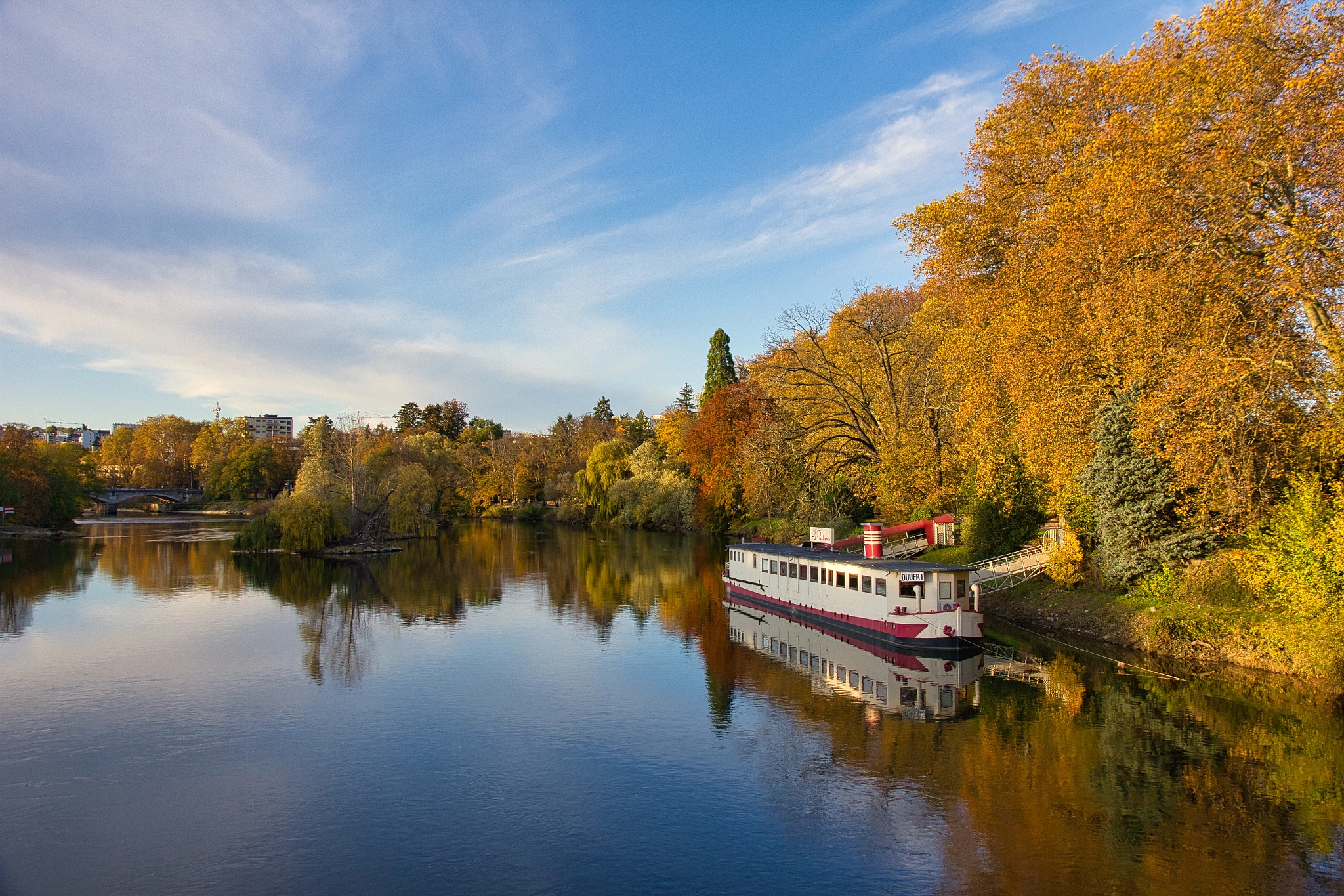 Autumn River Scene with Boat and Colorful Trees | landscape photo by Tchou V | 500px