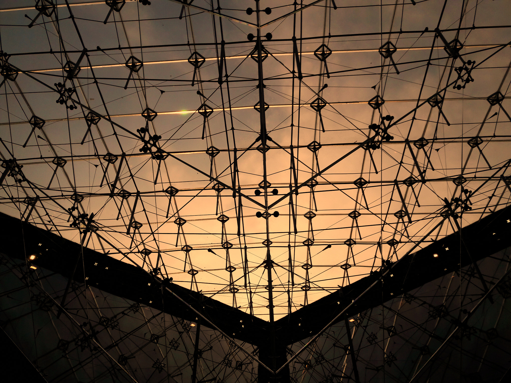 Glass Pyramid Structure Against Sunset Sky | city photo by Pierre ...