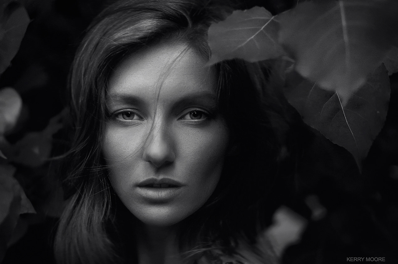 Intense Gaze Through Foliage Black and White | people photo by Kerry ...