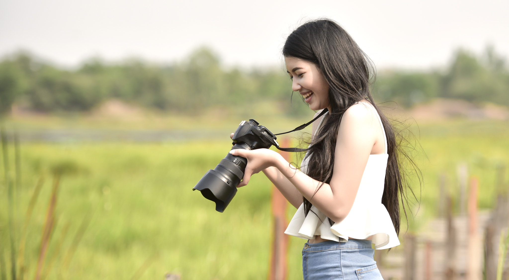 Cute young female photographer by Sasin Tipchai / 500px