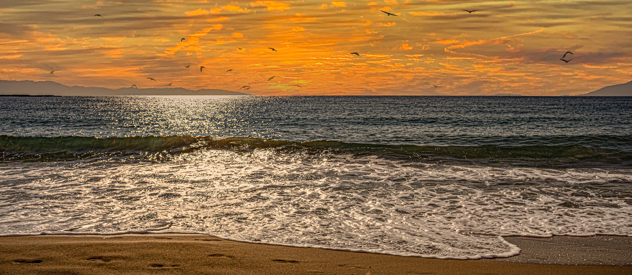 Vibrant Orange Sunset Over Calm Ocean Waves | landscape photo by ...