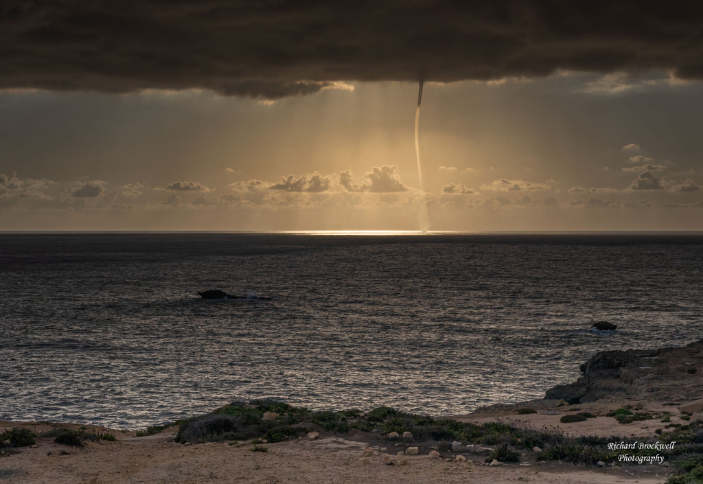 Waterspout on the horizon. by Richard Brockwell / 500px