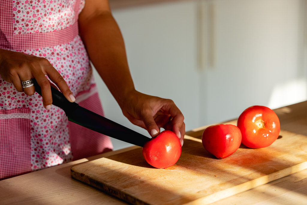 young woman cooking in the kitchen by Anton Yulikov / 500px