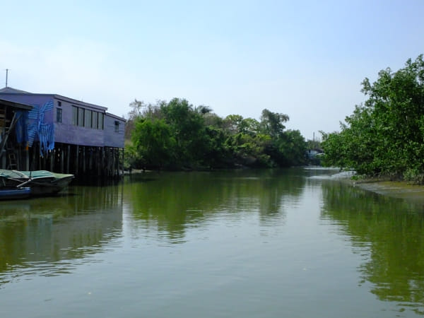 River in village by Garry Ho / 500px