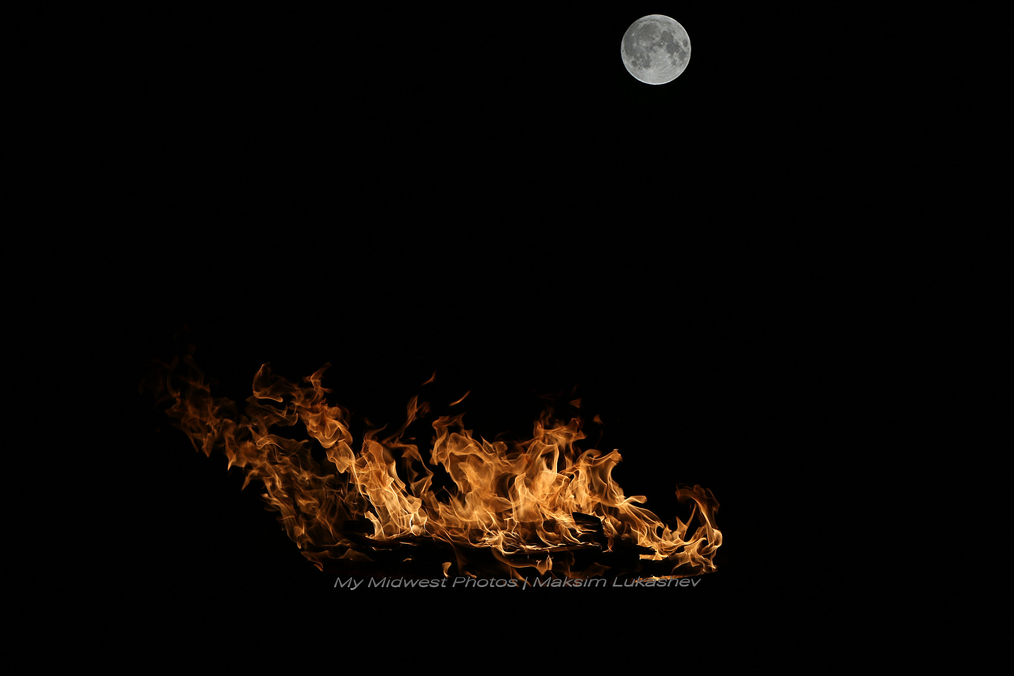 Fire under a full moon by Maksim Lukashev / 500px