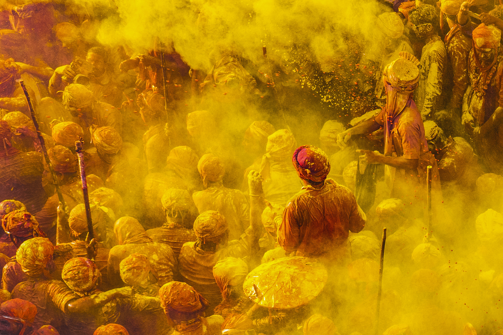 high angle view of people throwing powder paint during holi by Shambhu ...