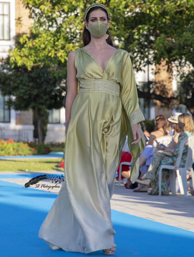 Elegant Model in Gold Gown on Blue Runway | people photo by Sheila ...
