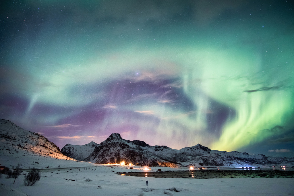 Aurora borealis explosion with starry on mountain by Thanayu ...