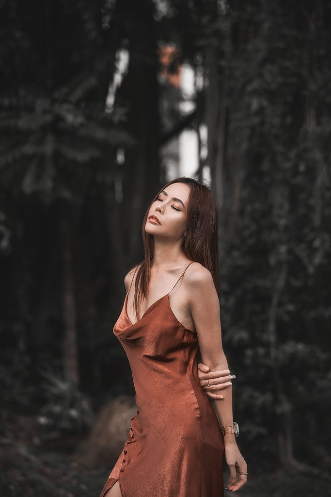 Anne Wara~~Young woman standing in forest by Steven Chiow / 500px
