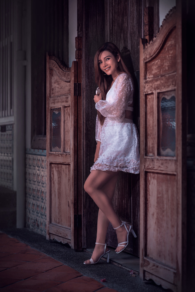 Thy Nga Pham ~~Full length of woman standing at doorway by Steven Chiow / 500px