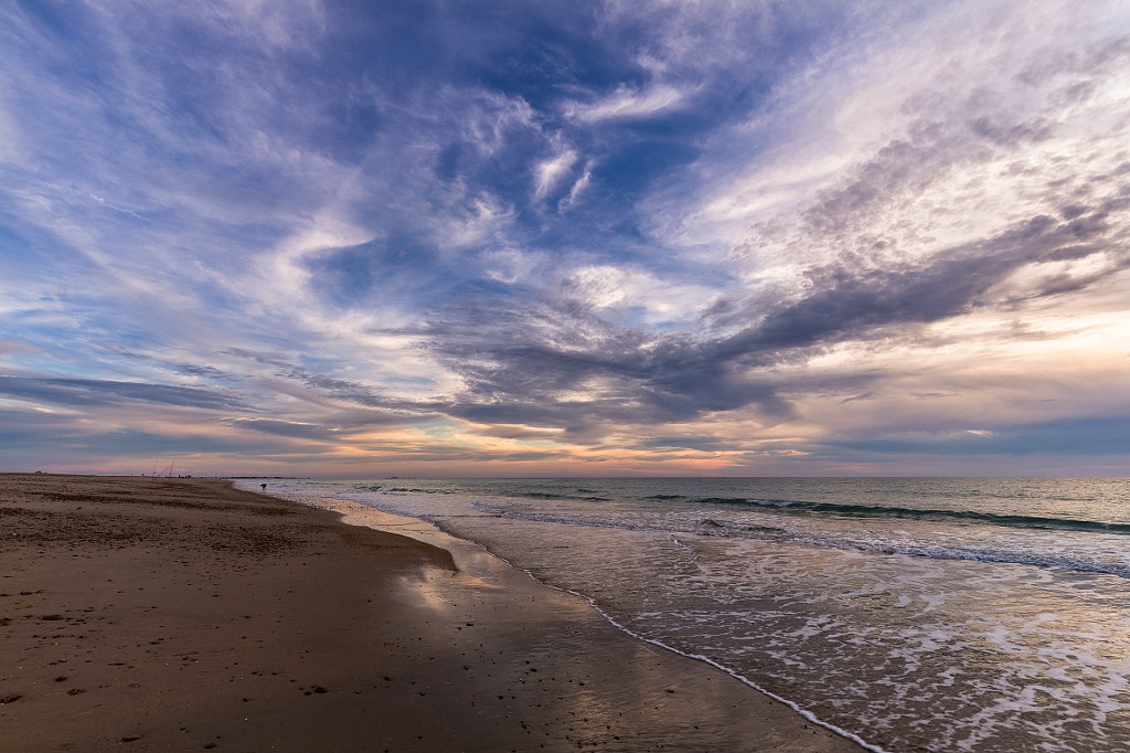 Scenic view of beach against sky during sunset by Natalie / 500px
