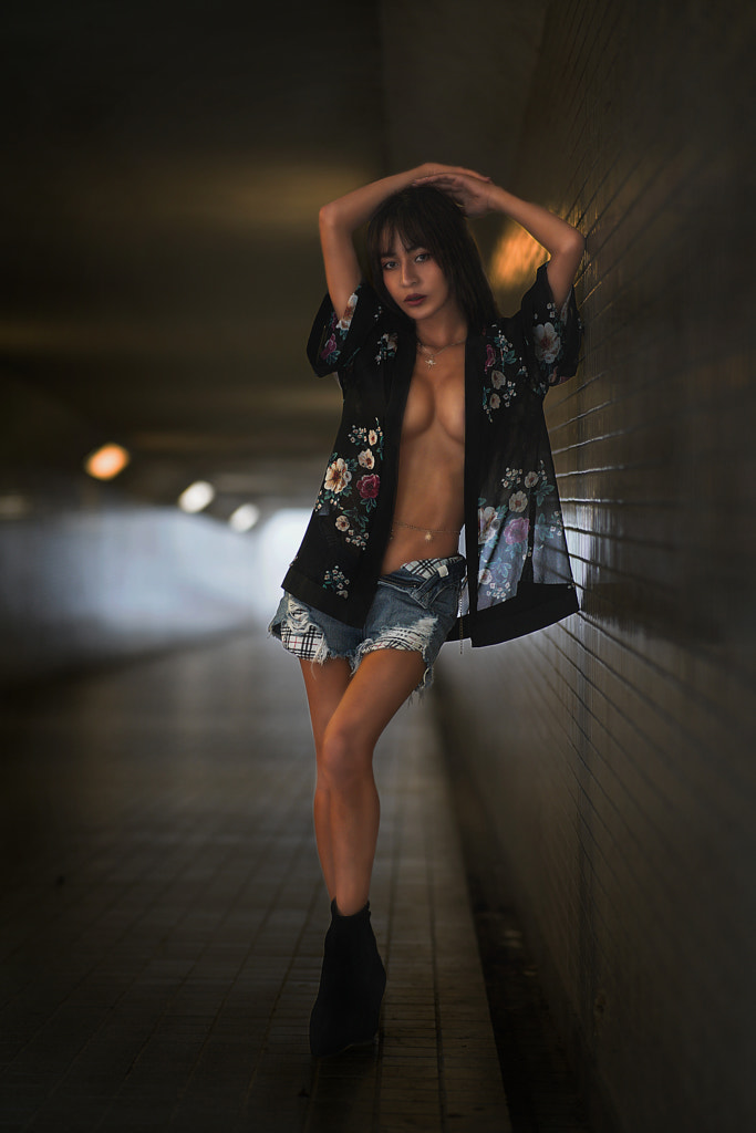 Poottawan Phunsiri~~Full length of woman standing in tunnel by Steven Chiow / 500px