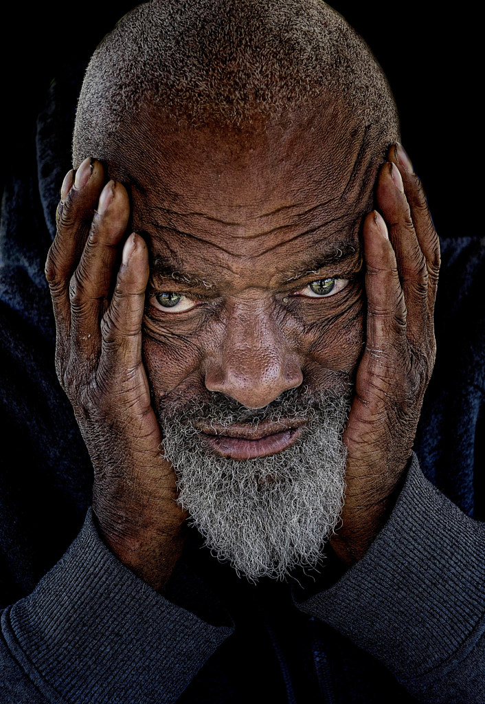 Close-up portrait of man against black background by Gary Koenig / 500px