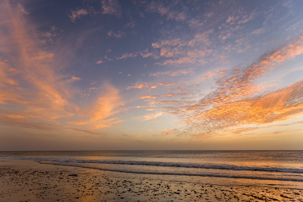 Scenic view of beach against sky during sunset by Natalie / 500px