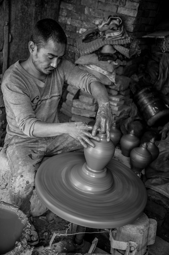 Man making pottery in workshop by Valentin Stegner / 500px