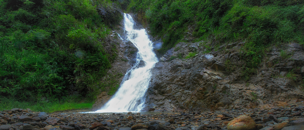 Scenic view of waterfall in forest by Khoi Tran Duc / 500px