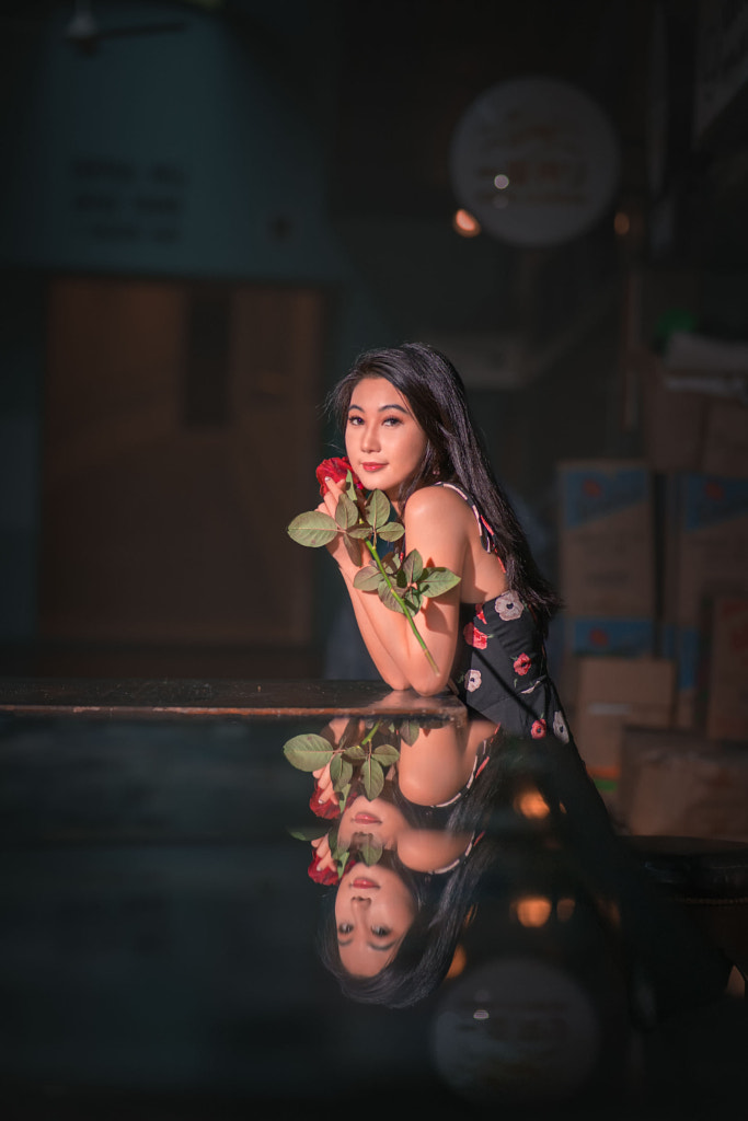 Chloe Choong~Portrait of young woman holding flower while sitting on floor by Steven Chiow / 500px