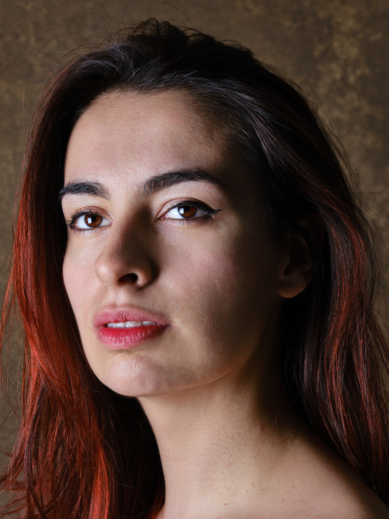 Close-up portrait of young woman against wall by Jacint Guiteras / 500px