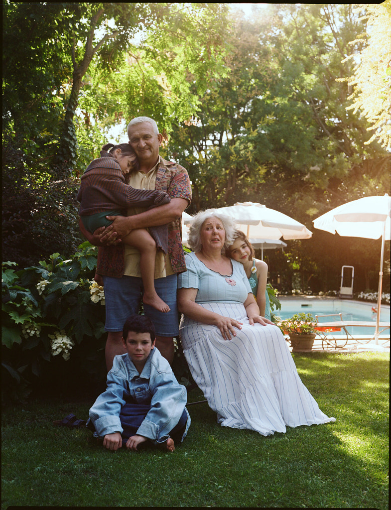 Portrait of happy family in garden - (analog shot) by Carlotta Ricci ...