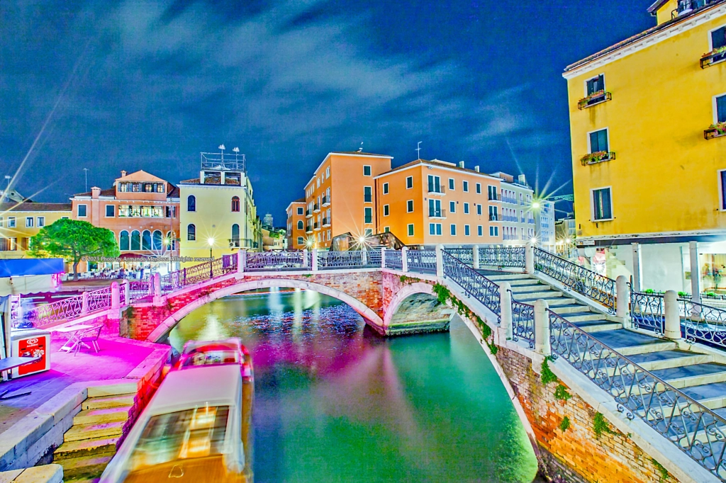 Futuristic Nighttime view of a Venetian canal with architecture ...
