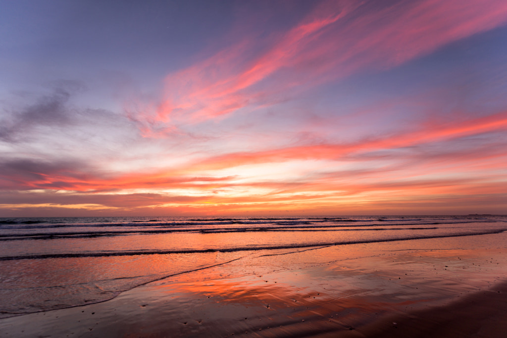 Scenic view of beach against sky during sunset by Natalie / 500px