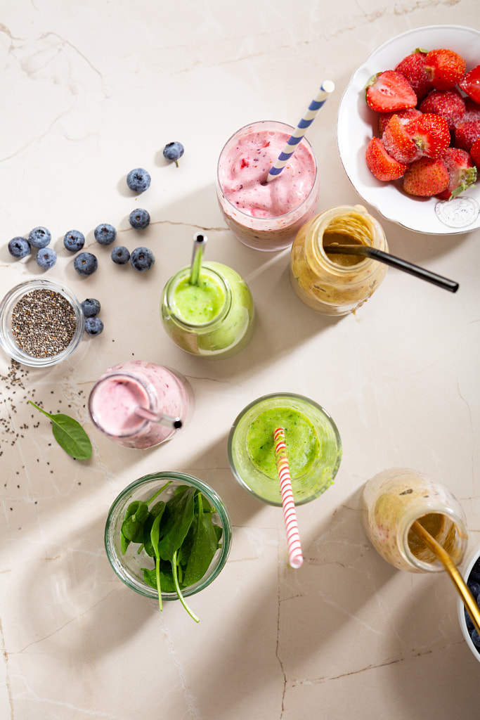 Vegan berry fruit spinach smoothie in bottles glass top view by Olha ...