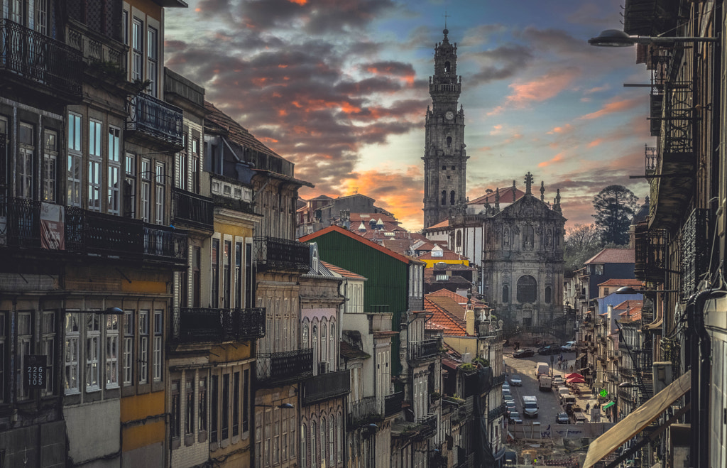 Aerial view of buildings in city against sky during sunset by Hannes ...
