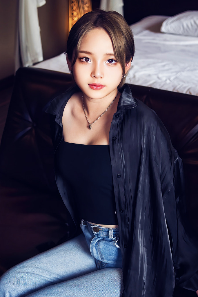 Portrait of beautiful woman sitting on bed at home by SENBUN YOSHITAKA / 500px