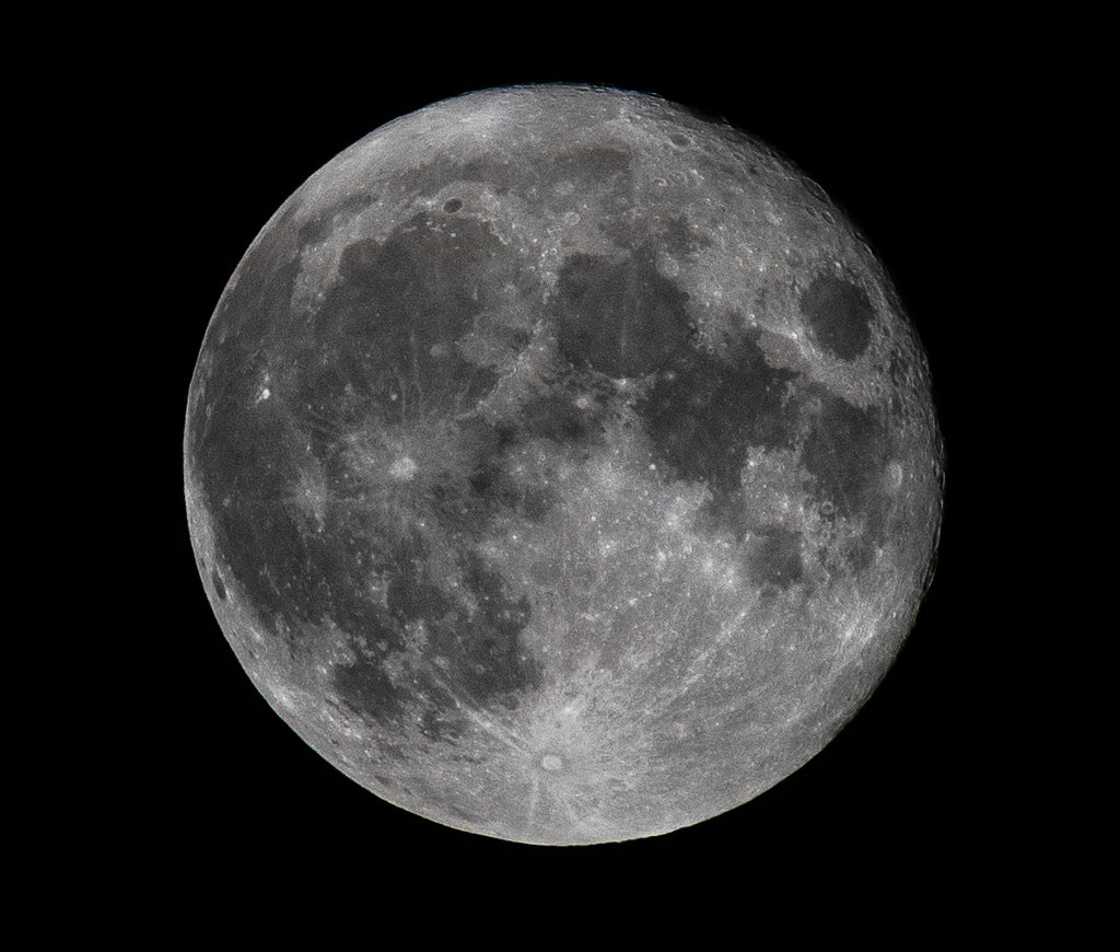 Low angle view of moon against clear sky at night by Ben Smith ...