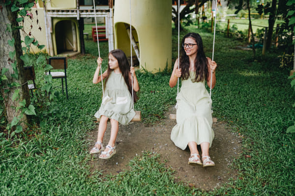 Mother and daughter swinging on a playground by Natalie Zotova | 500px