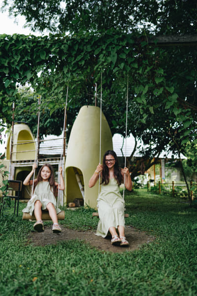Mother and daughter swinging on a playground by Natalie Zotova | 500px