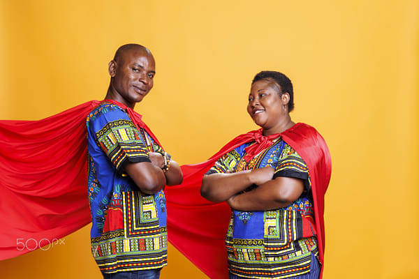 Couple wearing superhero capes portrait by Dragos Condrea | 500px