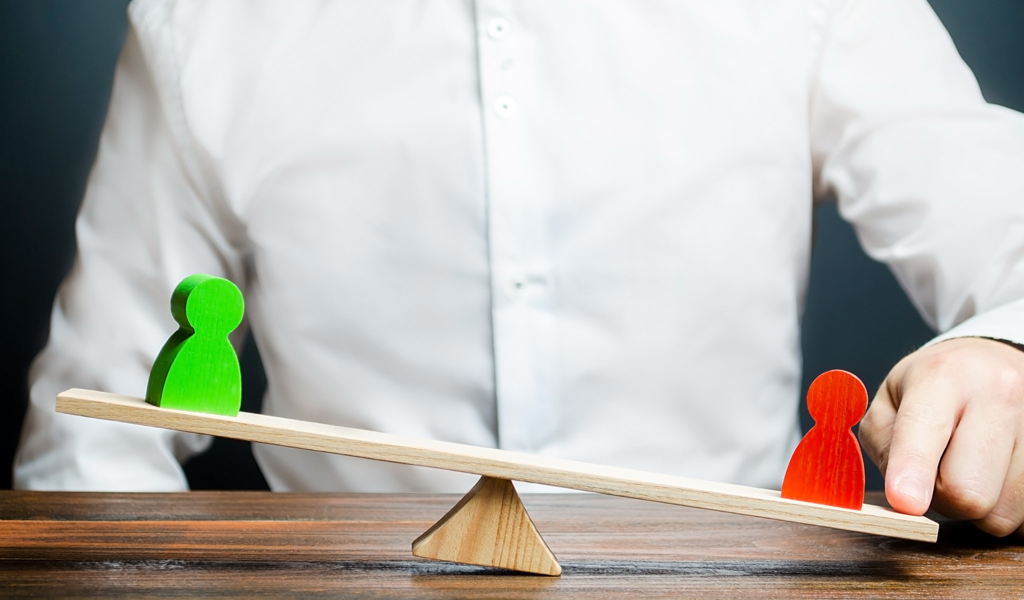 A man takes the side of a red figure in a dispute. Mediator and arbiter ...