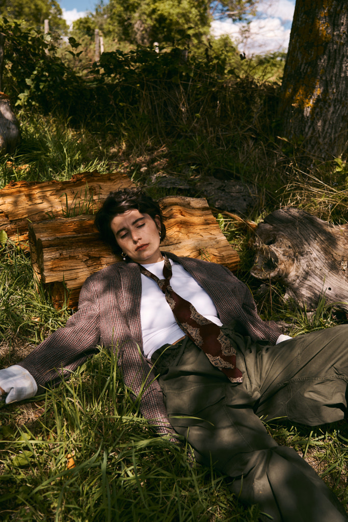 Young Man Lying in Grass by Logs | people photo by Giorgia Cinelli | 500px
