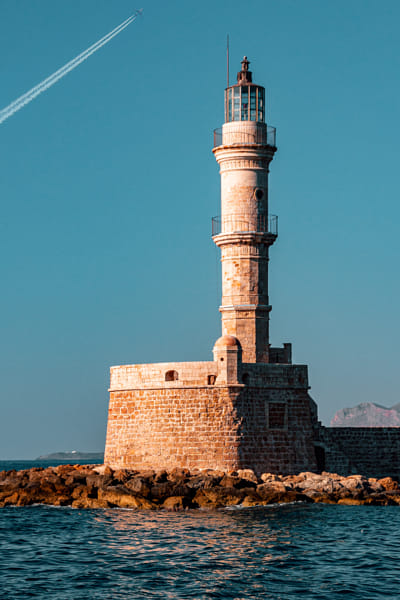 Historic Lighthouse Against Blue Sky with Airplane Trail | landscape ...