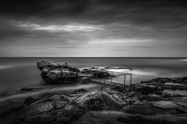Monochromatic Seascape with Rocky Shoreline and Pier | landscape photo ...