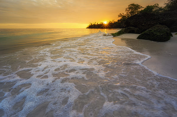 Scenic view of beach against sky during sunset by Lemuel Montejo / 500px