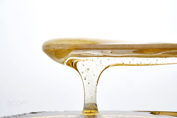 Photo of a sugar paste for depilation hair removal procedure. Texture ...