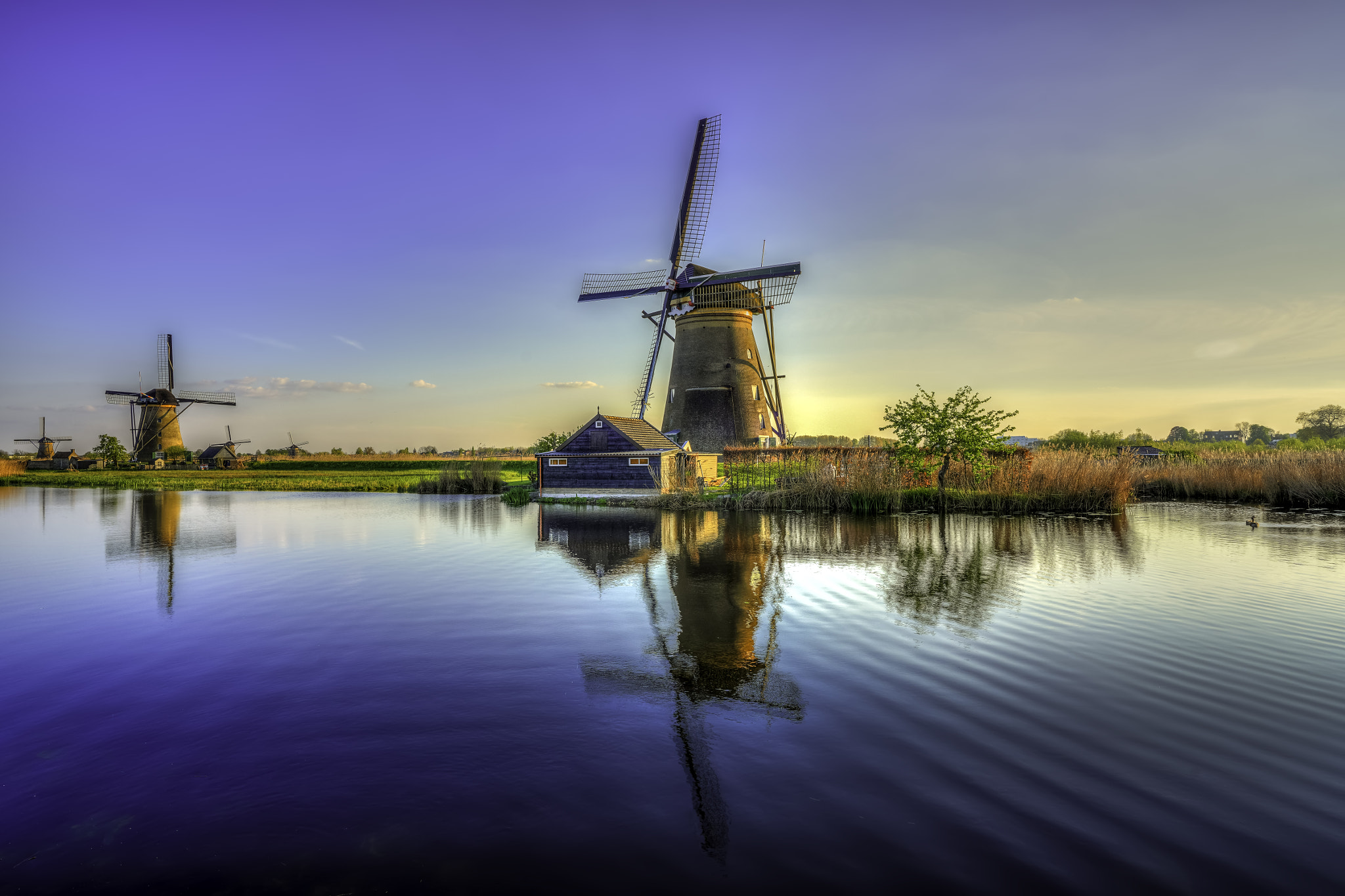 Historic Windmills Reflected in Calm Water at Sunset | landscape photo ...