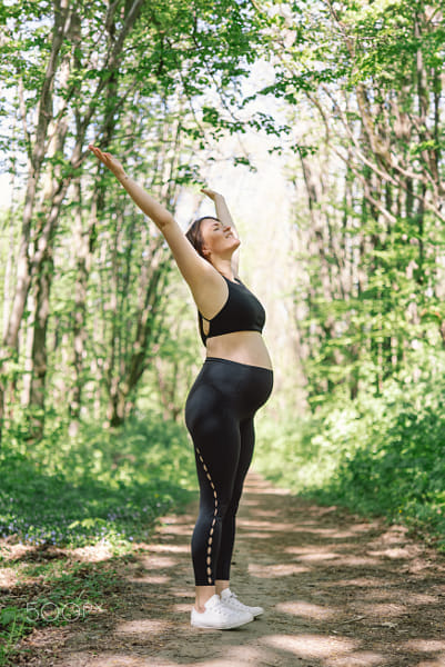 Pregnant woman doing fitness outdoors. by Anastasiia Stiahailo | 500px