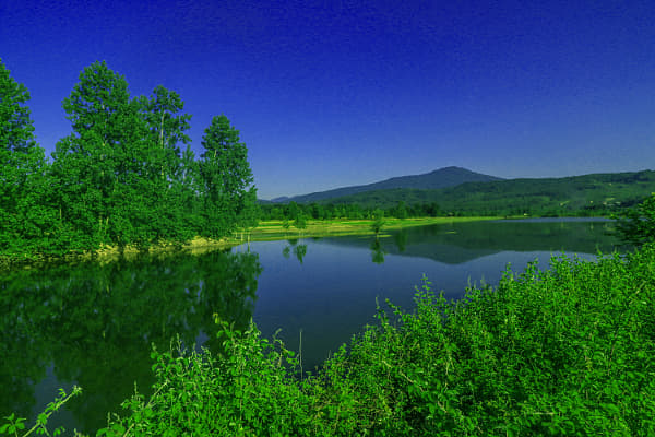 Scenic view of lake against clear blue sky by vahidshojaei52 | 500px