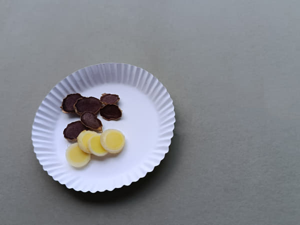 Black Turmeric and Mango Ginger Rhizome Slices on Paper Plate by ...