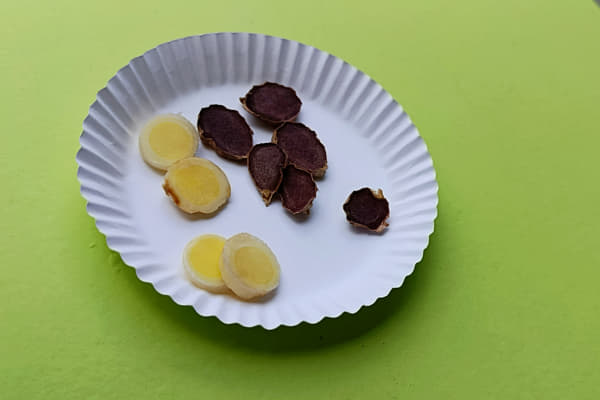 Sliced Mango Ginger and Black Turmeric on White Paper Plate by ...
