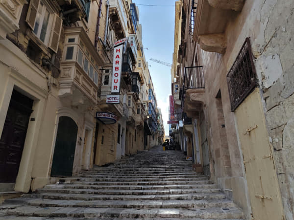 Low angle view of alley amidst buildings in city by AYUK NOVITA | 500px