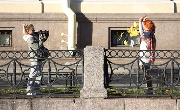 Two Figures Interacting by a Fence Symbolizing Connection and Shared ...