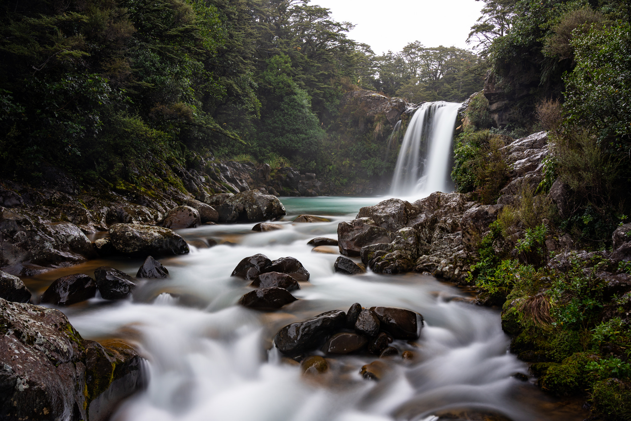 Cascading Waterfall Flows Through Lush Landscape Evoking Raw Power ...