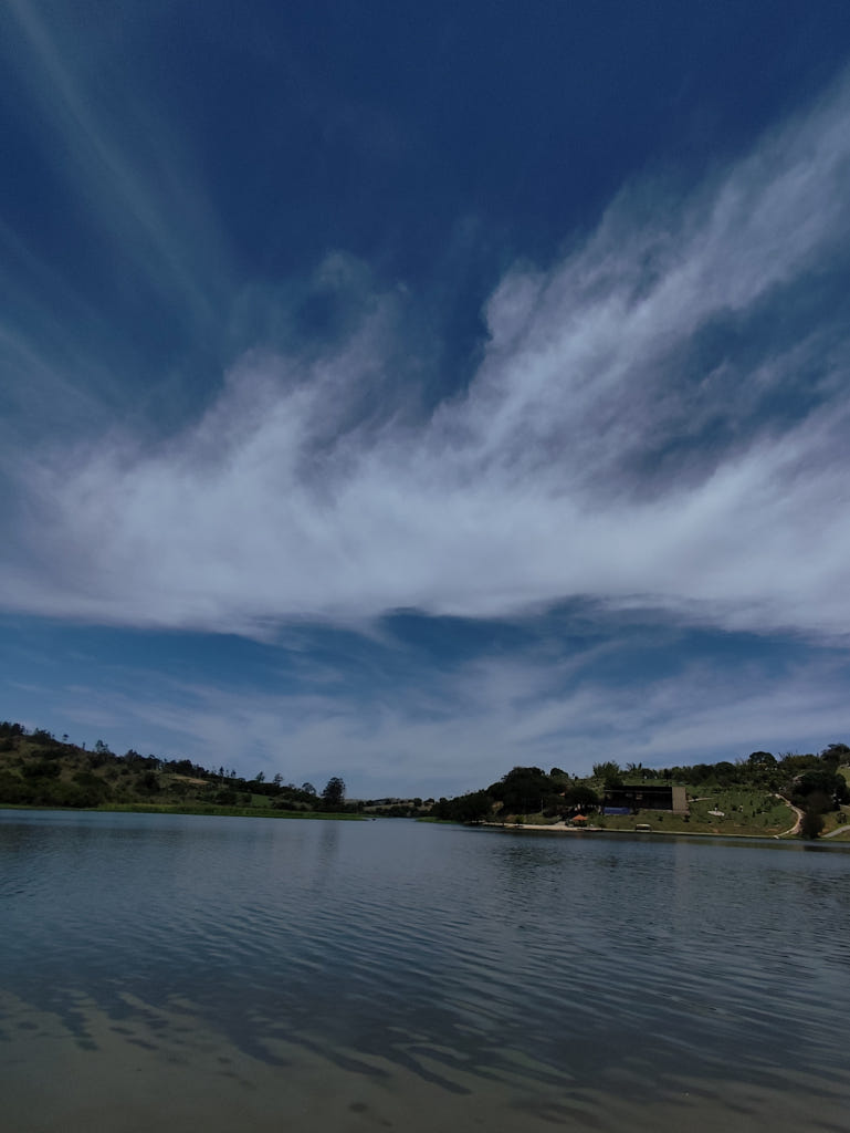 Expansive Lake Under Dramatic Sky Evoking Serenity and Vastness ...