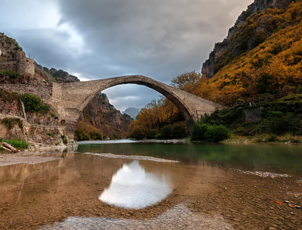 Ancient Stone Bridge Spanning River Reflecting Timelessness and ...