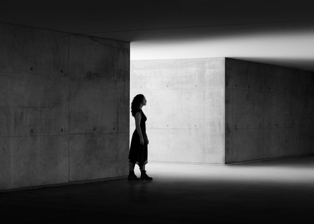 Woman on Bed Reflecting Introspection and Modern Connection | people ...